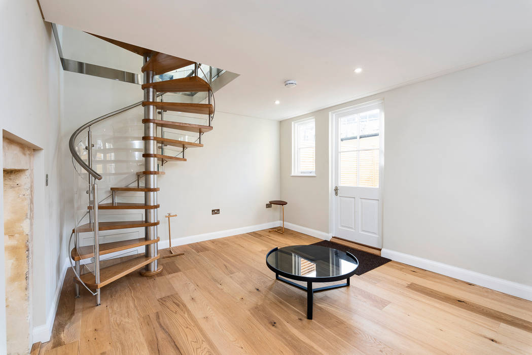 Spiral staircase with oak treads and curved perspex balustrade | homify