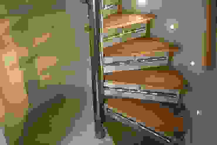 Spiral stair with sculptural detailing & 'Drip' handrail brackets. | homify