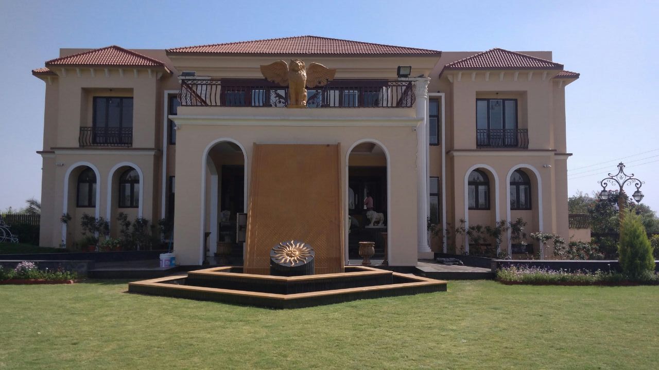 Elaborate home interiors and lawn designs from a home in Indore | homify