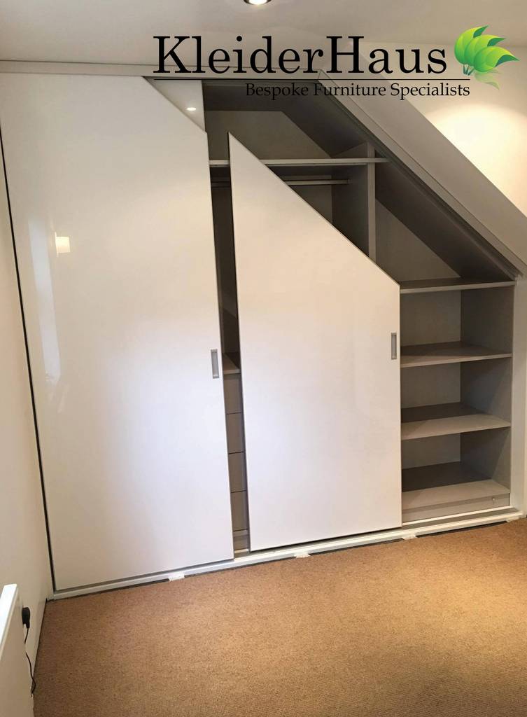 Fitted sloping ceiling sliding door wardrobe | homify