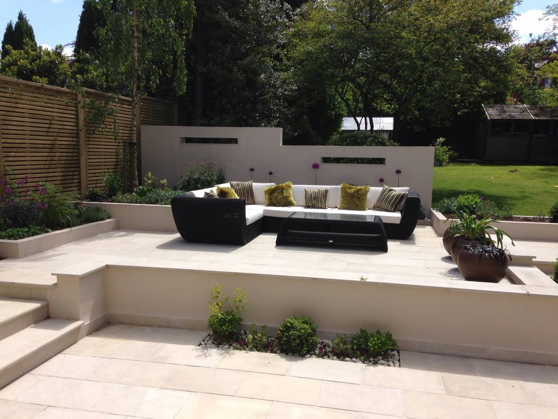 Contemporary Split level terrace: Buff sawn sandstone giving a ...