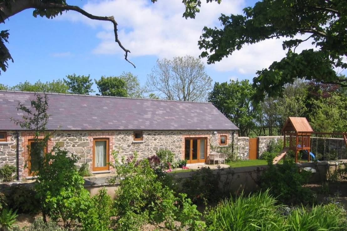 Hilltop stone farm buildings converted and extended to form modern ...