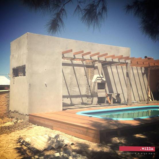 Varanda com piscina e churrasqueira para relaxar | homify