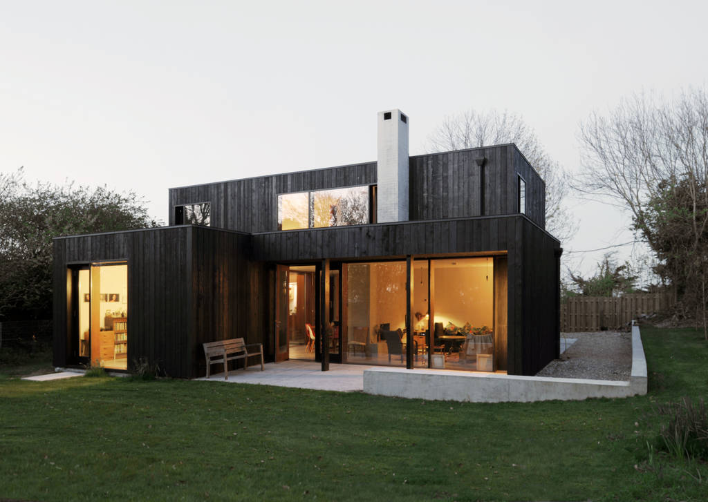 A timber-clad house design on the isle of wight: the sett, dow jones ...
