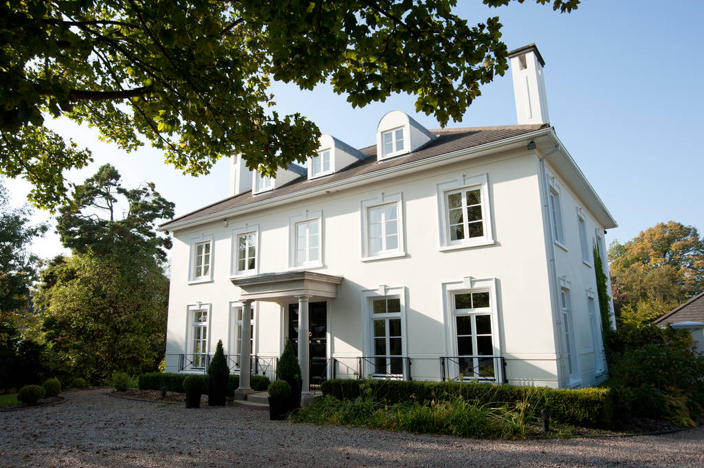 Circular atrium lit from above forms central circulation space to this ...