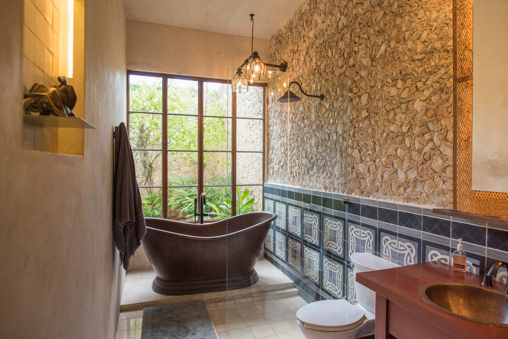 Casa tres dragones: baños de estilo por taller estilo arquitectura ...