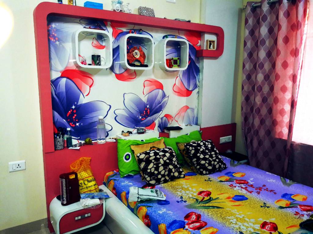 Bed with stylish head board and a stunning dressing table in the front. | homify