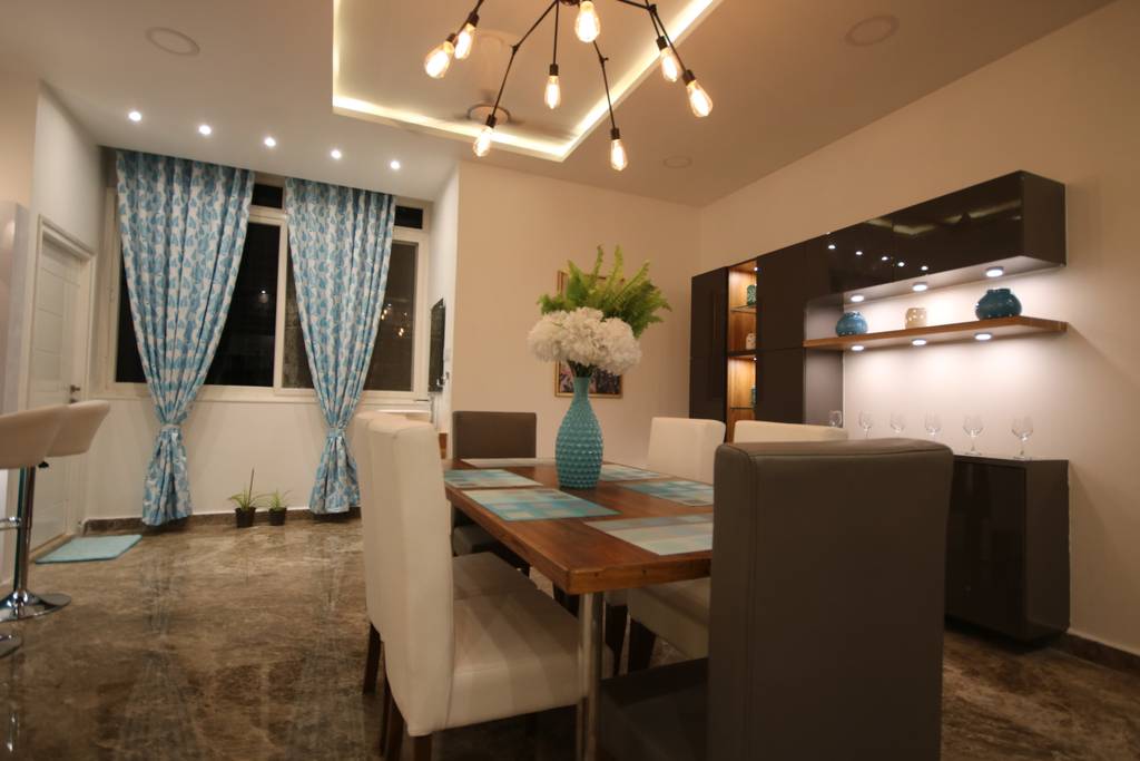 Dining with open modular kitchen and breakfast counter view | homify