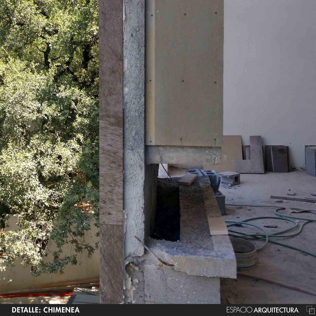 Detalle de chimenea con recubrimiento de piedra en Monterrey | homify